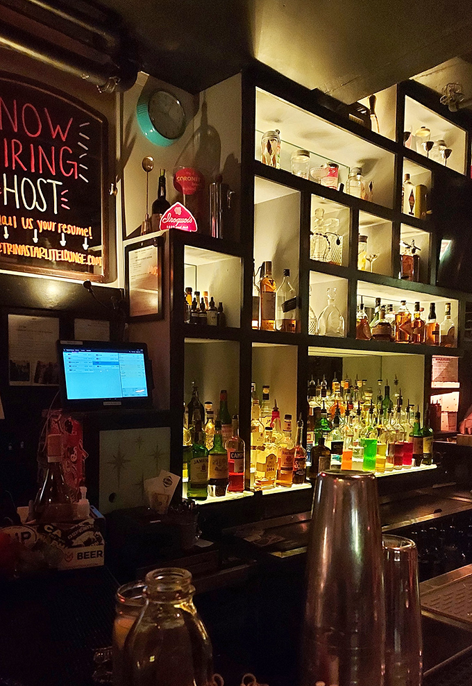 The bar at Trina's doesn't just serve drinks&mdash;it crafts liquid memories. Those illuminated bottles promise adventures in a glass, no passport required.