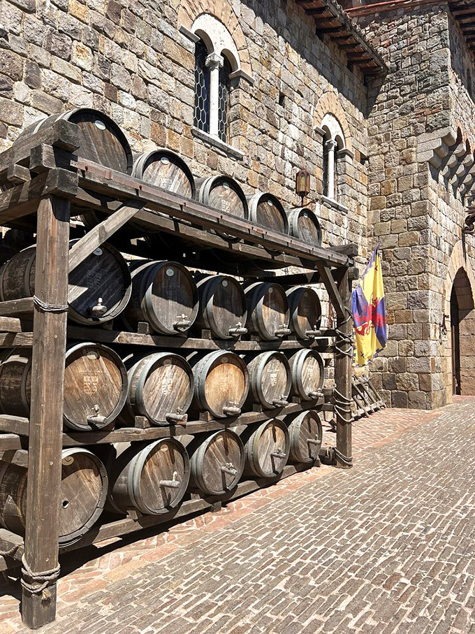 Wine barrels stacked against ancient stone walls&mdash;where old-world craftsmanship meets California sunshine. The perfect marriage of form and function.
