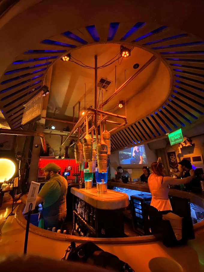 The circular ceiling detail draws your eye upward while the bar's architectural elements create that "distant planet outpost" vibe fans crave.