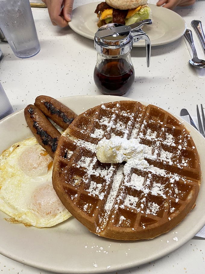 The waffle that makes you reconsider your life choices. Golden, crisp, and dusted with powdered sugar &ndash; breakfast doesn't get more perfect than this.