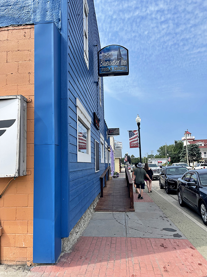 The Blue Water Inn's vibrant exterior promises good times inside&mdash;like a wink from the building itself.