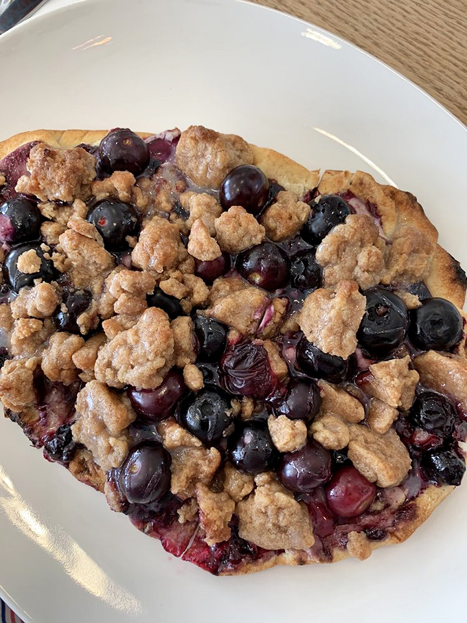 Berry crumble meets flatbread in a dessert that's having an identity crisis in the most delicious way possible.