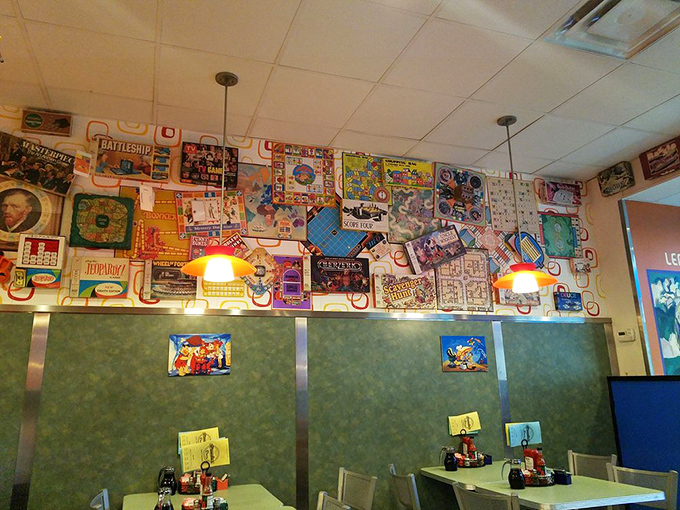 The walls aren't just decorated – they're plastered with board games that remind you of rainy days at grandma's house.