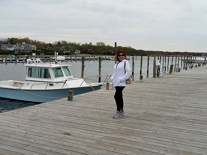 Bellport's marina boardwalk invites leisurely strolls where the only agenda is watching boats bob and listening to halyards clink against masts.