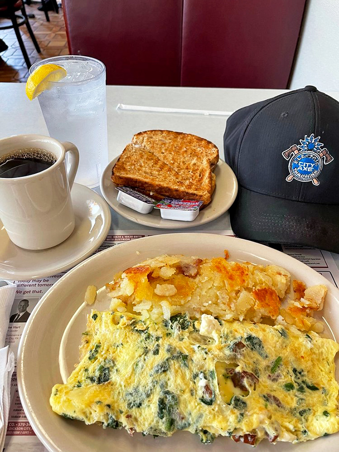 Morning glory on a plate&mdash;a spinach and cheese omelet that makes vegetables feel like an indulgence. That perfectly golden toast is ready for its supporting role.
