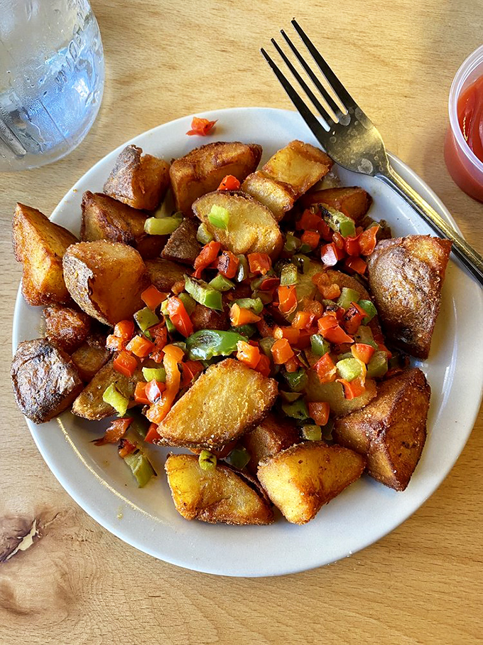 Breakfast potatoes that didn't just wake up like this&mdash;they were crafted with care. The veggie confetti on top is the morning party your taste buds deserve.