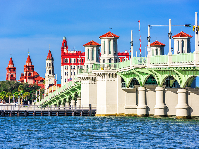 The Bridge of Lions connects mainland to barrier islands, its iconic green spans and marble sentinels standing guard over St. Augustine's azure waters.