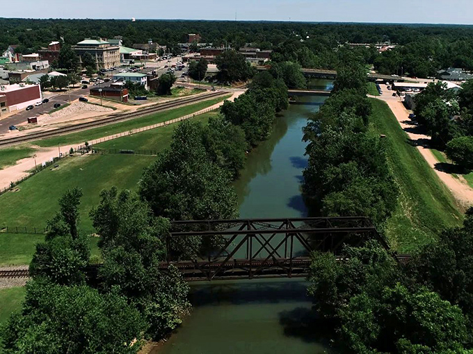 The calm waters of the Black River wind through town like a ribbon of blue, with bridges connecting the community across its banks.