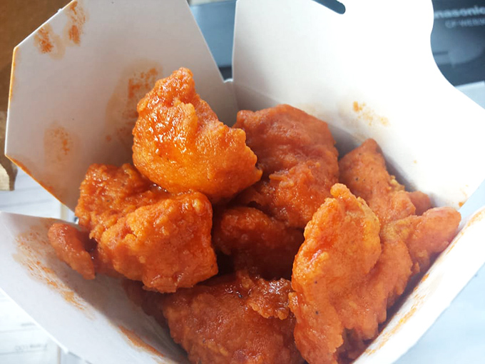 Buffalo chicken bites bringing the heat in their saucy orange glory. These little flavor bombs demand respect&mdash;and plenty of napkins.