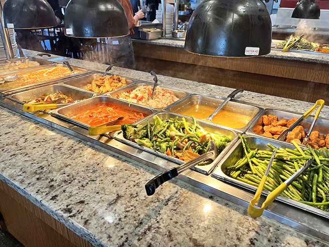 Steam rises from these hot dishes like aromatic fog, with green beans standing at attention next to saucy orange chicken and golden curry.