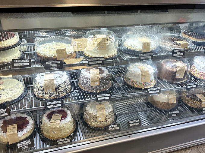 The cake display showcases Italian-American dessert artistry&mdash;each creation promising to end your meal on a sweet high note.