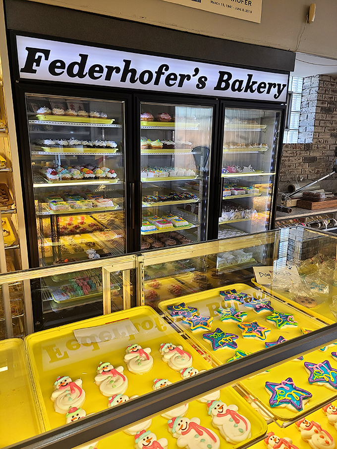 The refrigerated display &ndash; where cake dreams are born and diet resolutions go to die in the most delicious way possible.