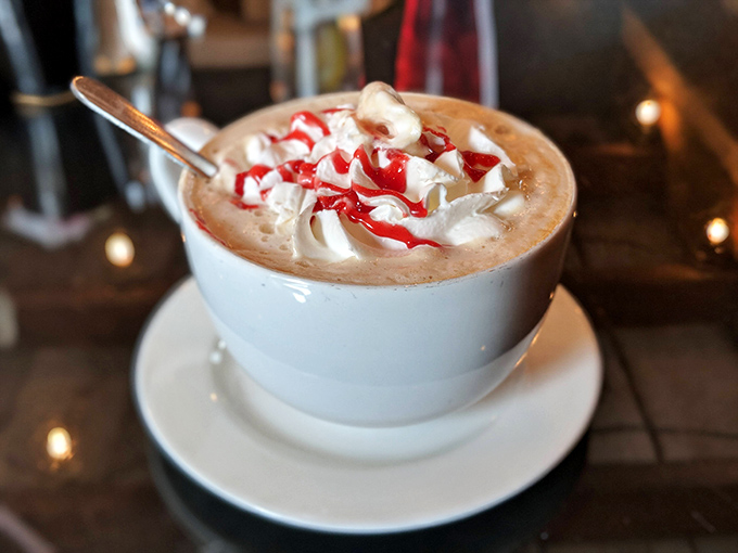Hot chocolate topped with whipped cream and candy cane pieces &ndash; because some drinks deserve to be called liquid happiness.