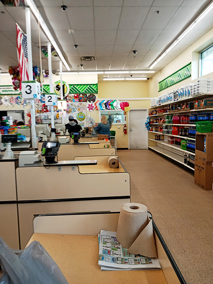 Where shopping journeys end and savings are tallied, under the watchful eye of Old Glory and efficient numbering systems.