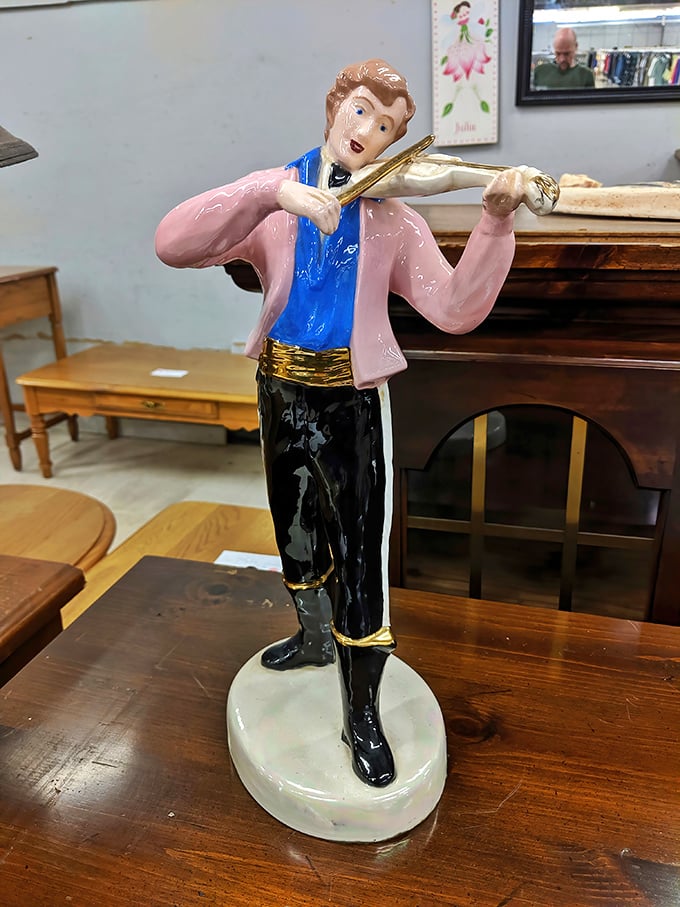 Hello, quirky conversation piece! This violin-playing figurine is exactly the kind of unexpected find that makes thrift shopping so addictive.