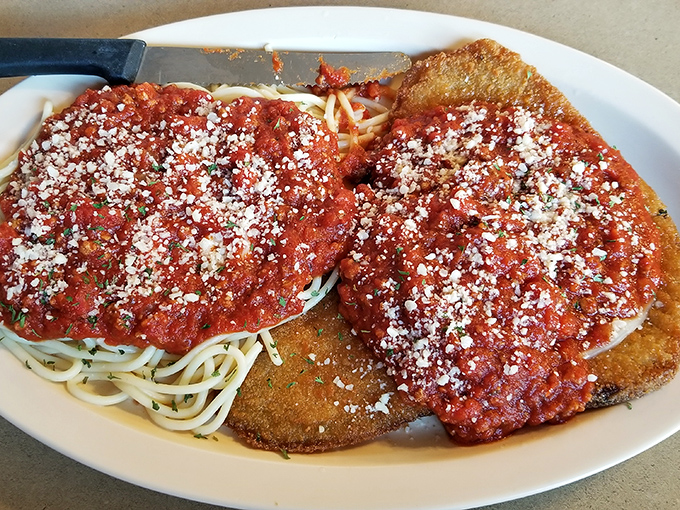 Italian comfort meets diner expertise. This chicken parmesan looks like it took a wrong turn from a high-end Italian restaurant and landed happily on this diner plate.