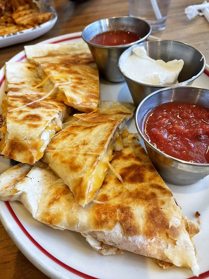 Quesadillas done diner-style&mdash;crispy, cheese-filled wedges with dipping sauces standing by for duty. Simple pleasures elevated to art form.
