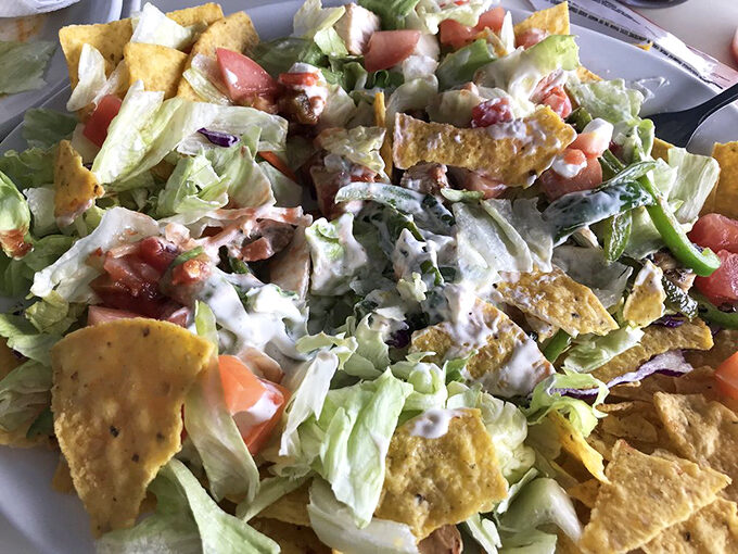 A salad that doesn't apologize for being delicious. Those tortilla strips aren't just garnish&mdash;they're essential crunch architecture.