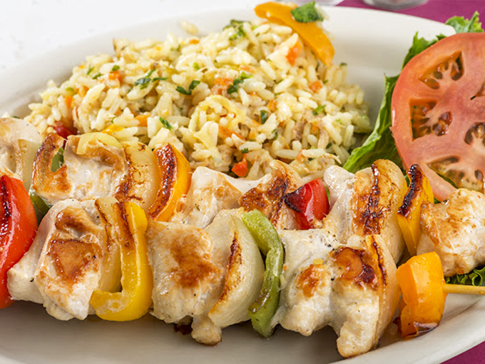 Skewered perfection surrounded by colorful vegetables and rice&mdash;proof that Belgrade Gardens knows its way around more than just the fryer.