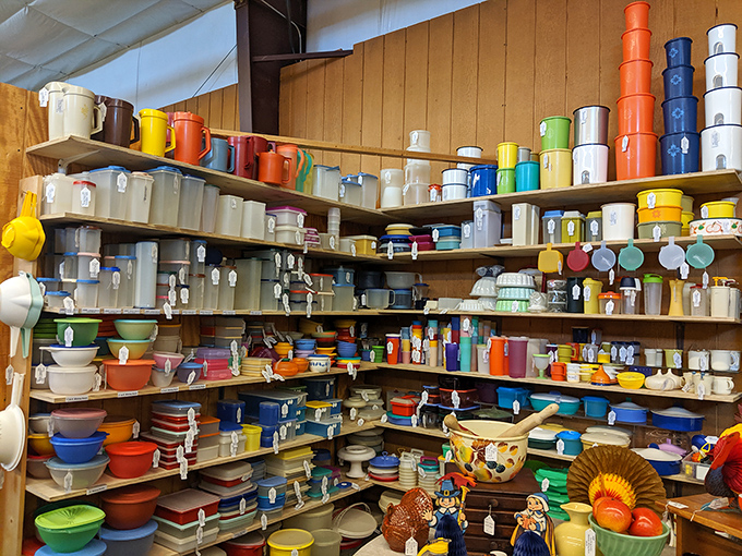 A rainbow explosion of vintage Pyrex and Tupperware that would make Marie Kondo weep. Every piece sparks joy and kitchen envy simultaneously.
