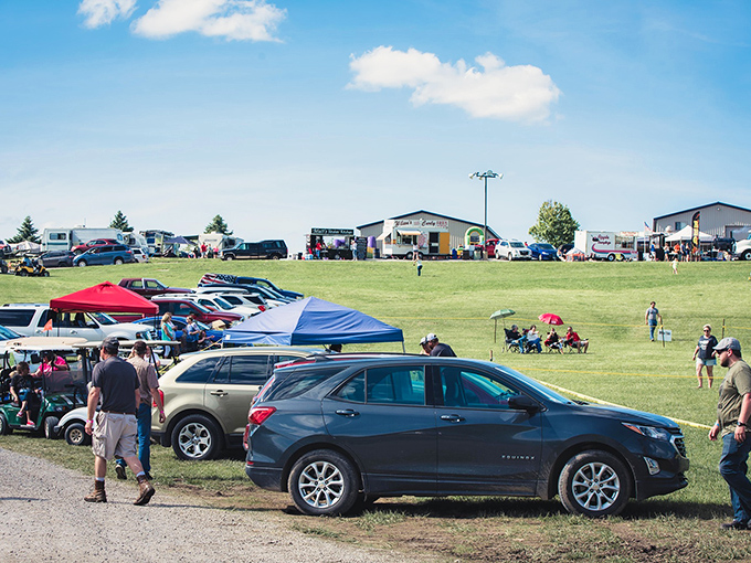 Community gathering in full swing &ndash; where lawn chairs and pop-up tents create a temporary neighborhood united by whatever's happening at the far end of that field.