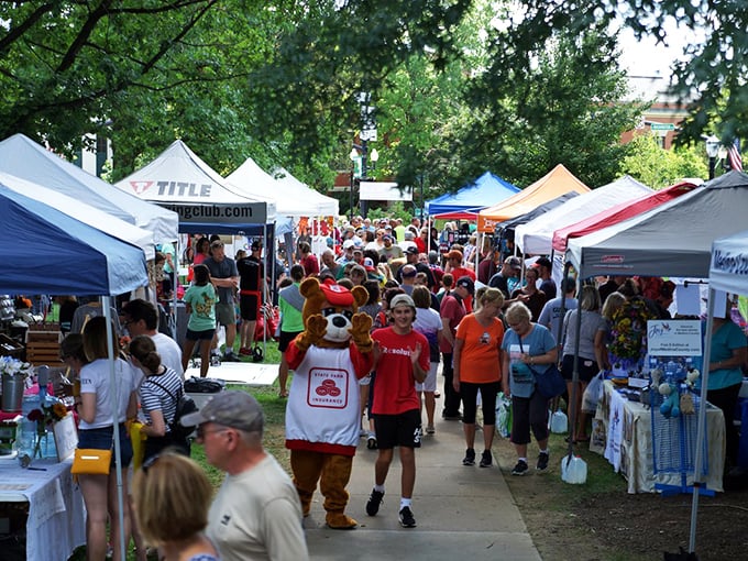 The farmers market brings together vendors, visitors, and apparently mascots&mdash;because nothing says "fresh produce" like a person in a bear costume on a hot summer day.
