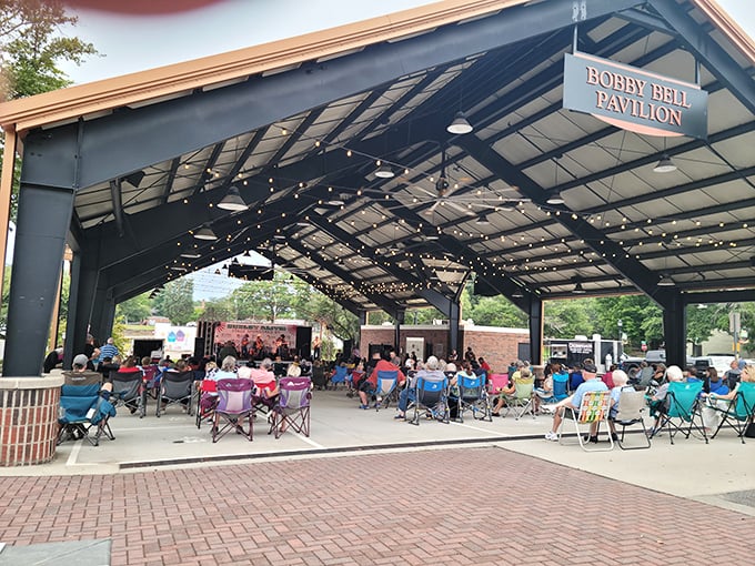 The Bobby Bell Pavilion transforms into an open-air concert venue where lawn chairs replace luxury boxes and music sounds better under open skies.