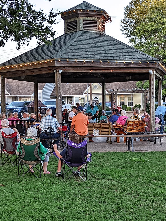 The town gazebo transforms into an impromptu concert hall where lawn chairs are the VIP section and everyone gets backstage access. 