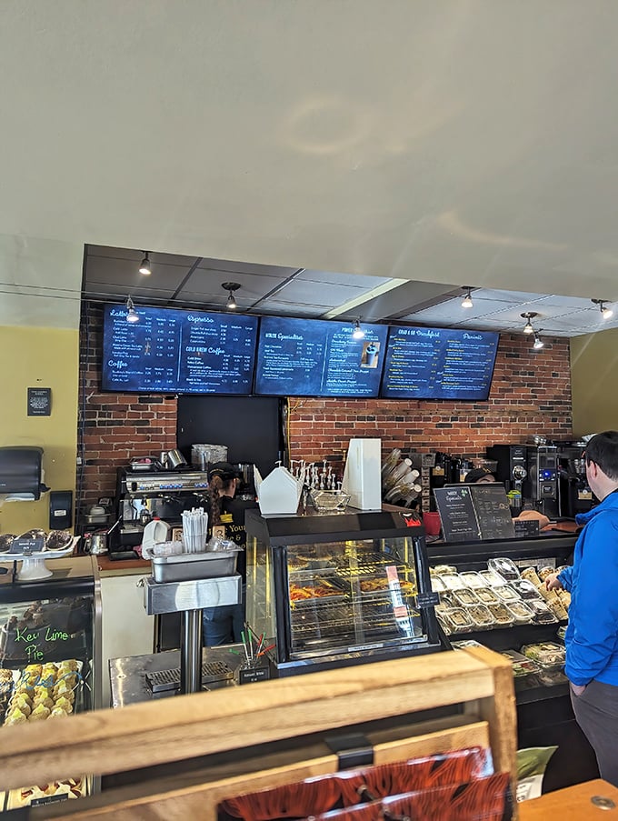 The counter view reveals the command center of culinary operations. Those menu boards aren't just lists&mdash;they're treasure maps to flavor country.