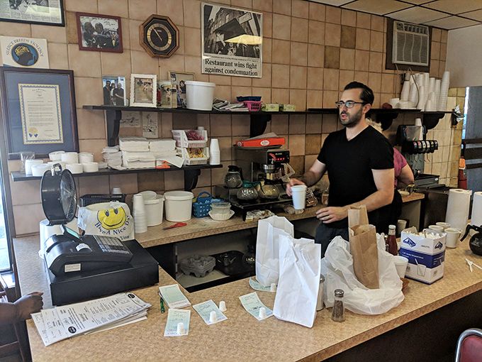 Behind the counter, where breakfast dreams become reality. The heart of Libby's operations, where efficiency meets hospitality with a side of local charm.