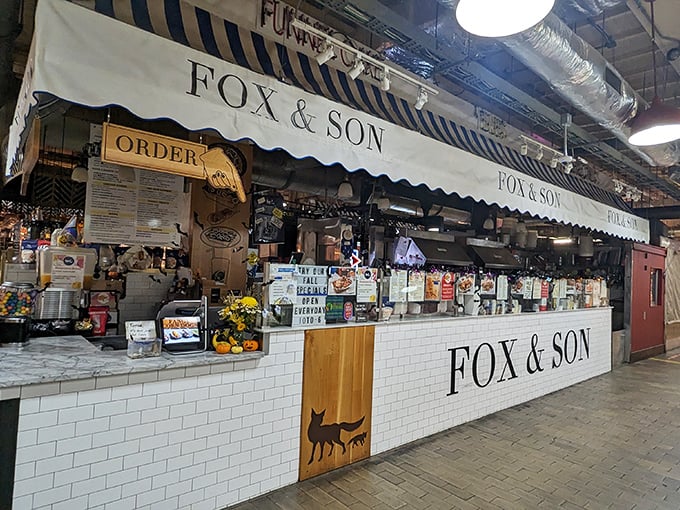 The white tile and wood accents create a modern carnival stand where every order is a ticket to flavor country.