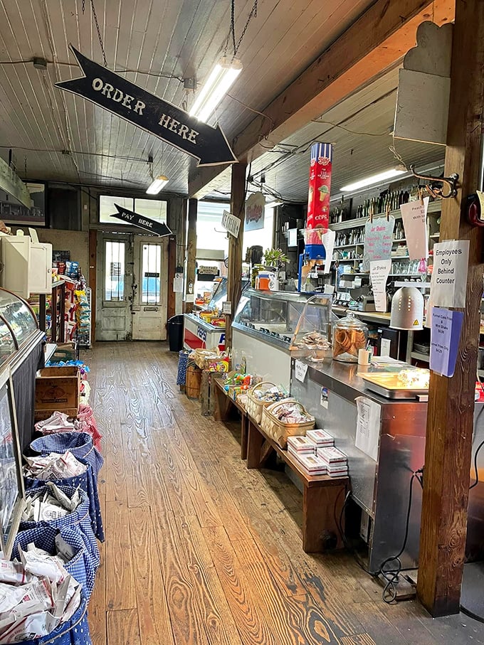 The "ORDER HERE" sign points the way to culinary happiness, where glass cases protect homemade pies and countertops have witnessed countless elbows.