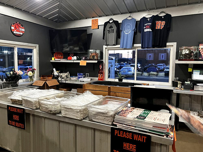 The counter where meat destinies are decided. Those "Please Wait Here" signs might as well say "Life-Changing Barbecue Just Beyond This Point."