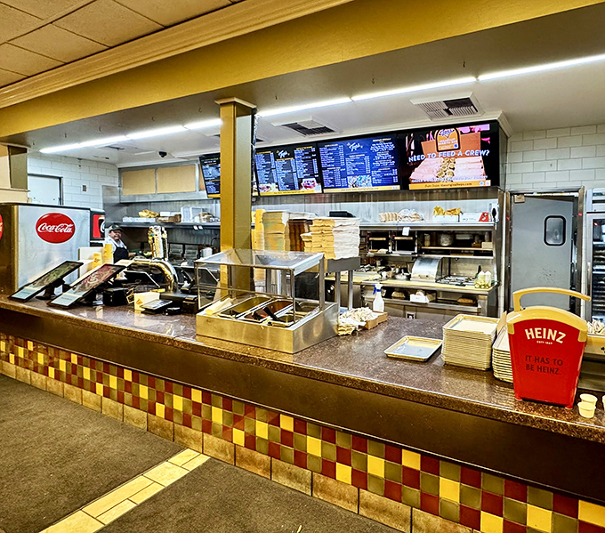 The counter where dreams come true. Behind that colorful tile facade lies the gateway to flavor town, no passport required.