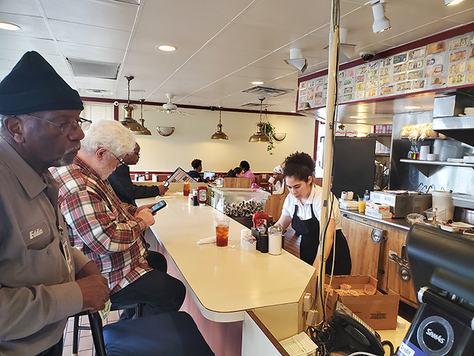 Where strangers become neighbors over shared condiments and the gentle percussion of forks against plates creates the soundtrack of satisfaction.