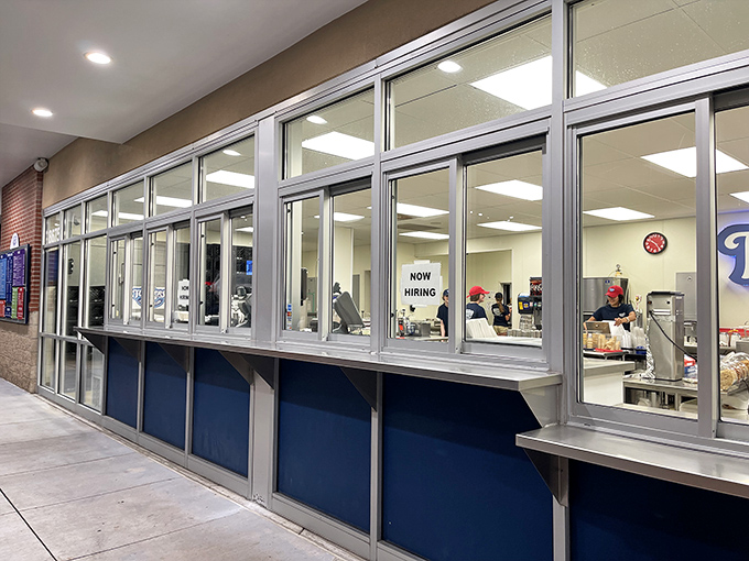 The service window&mdash;where dreams and reality meet. Like peeking into Santa's workshop, but instead of toys, they're crafting frozen happiness.