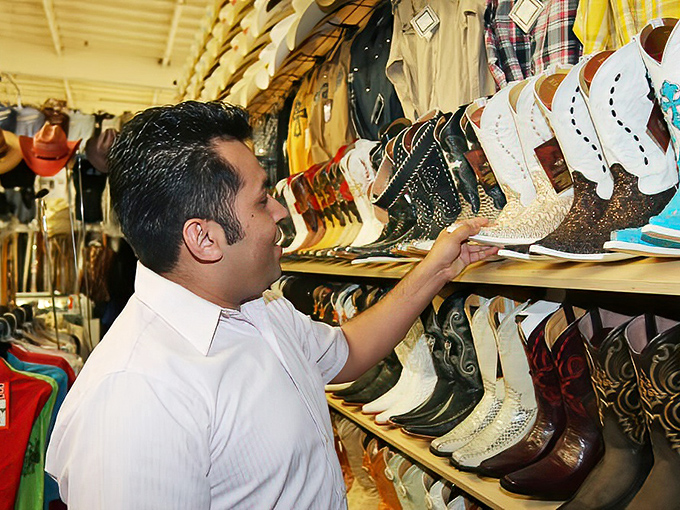 Cowboy boots that would make any country star jealous, arranged like a museum of southwestern fashion evolution.