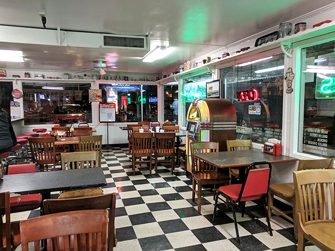 Evening at Snow White transforms the diner into a neon-lit sanctuary where the jukebox whispers promises of pie and milkshakes.