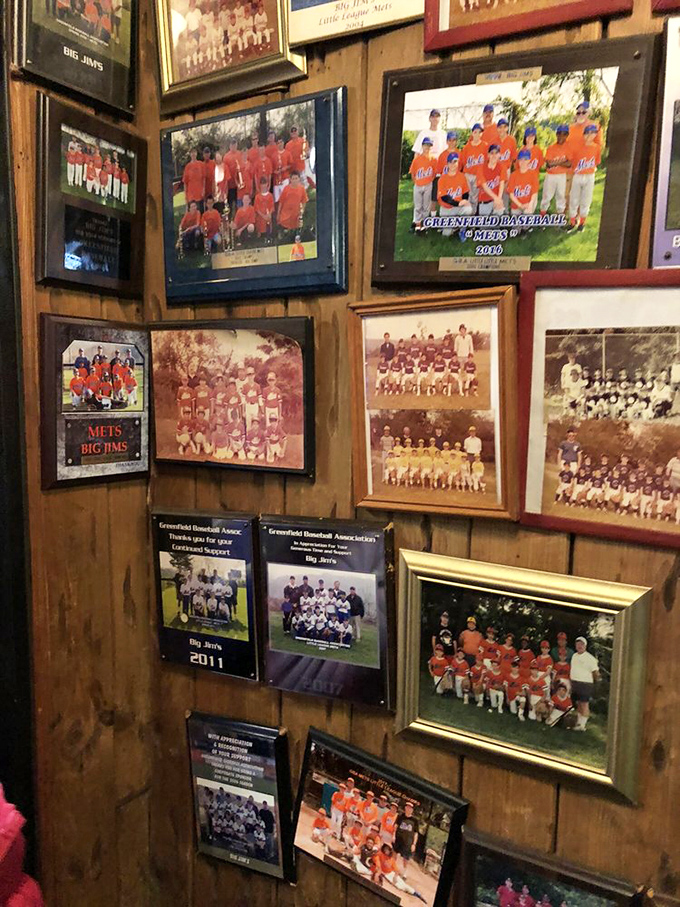 The wall of youth sports teams tells the story of a restaurant that's been feeding champions and consoling the defeated for generations.