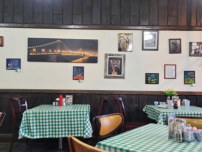 The wall art collection isn't random&mdash;it's a community scrapbook. That bridge photo reminds you there's a world outside, but why leave?