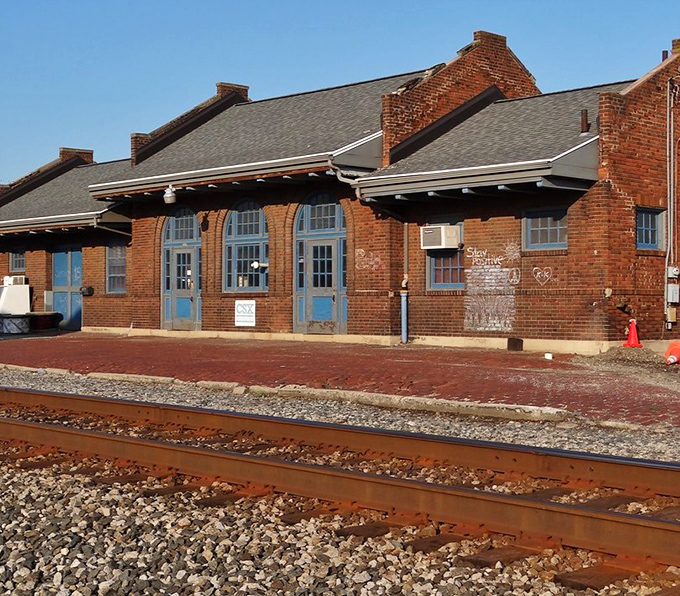 The old train depot stands as a brick-and-mortar reminder of when the most exciting sound in town was the whistle of the 3:15 pulling in.