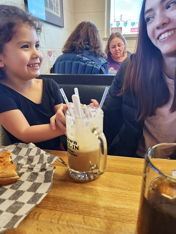 Multi-generational joy around a root beer float. Some traditions are worth preserving, especially when they involve ice cream and homemade soda.