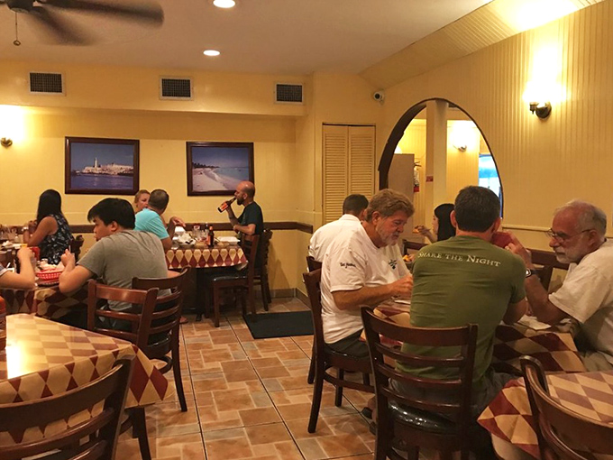 Where strangers become friends over shared plates and stories. Notice how nobody's looking at their phones? That's the power of truly good food.