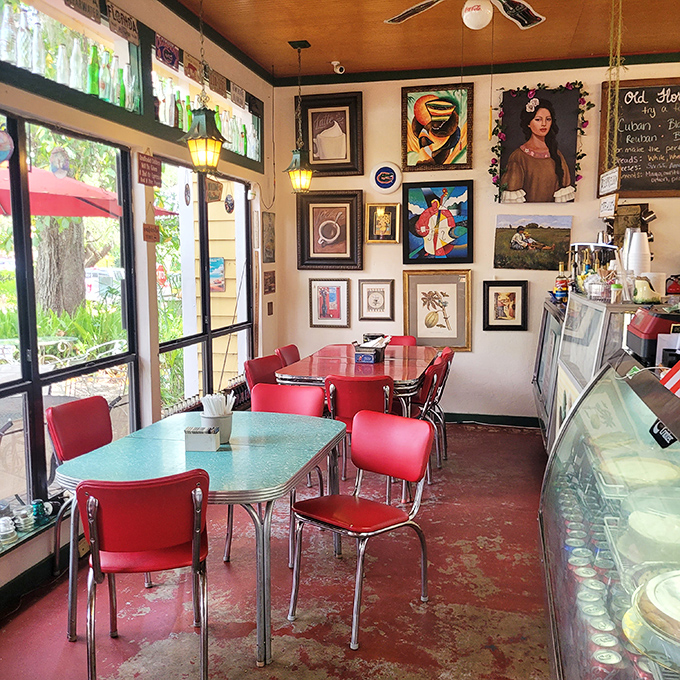 Retro red chairs and vintage-inspired tables create a dining space that feels both timeless and completely of-the-moment.