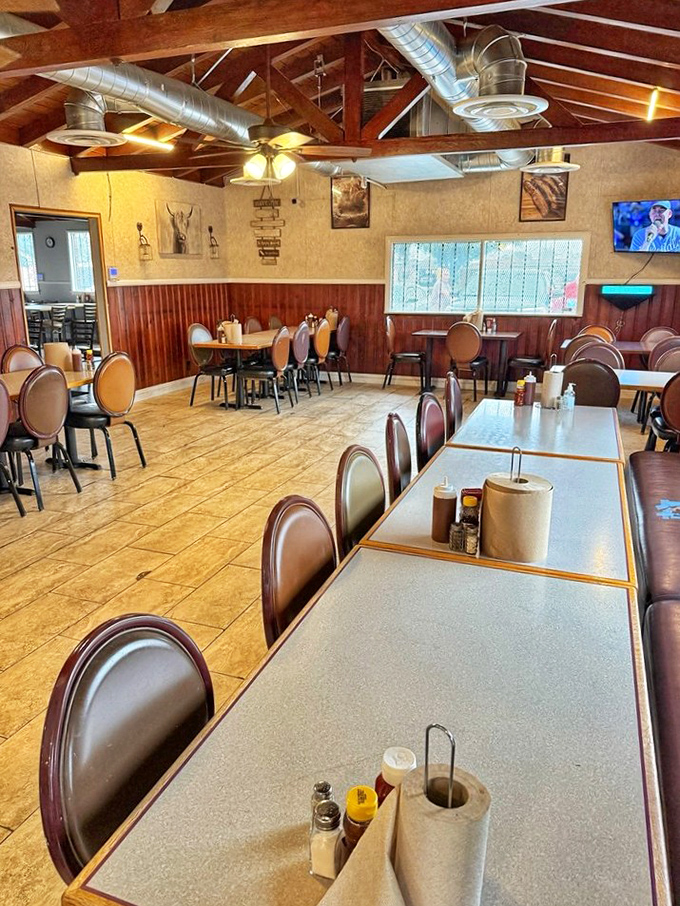 Long tables ready for barbecue communion, where strangers become friends united by the universal language of "mmm" and "pass the napkins, please."