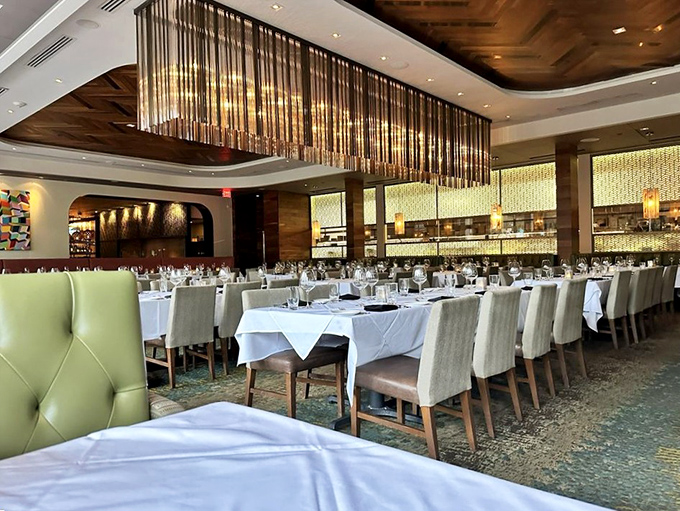 White tablecloths and mint-green chairs create the perfect backdrop for memory-making. That chandelier isn't lighting&mdash;it's jewelry for the ceiling.