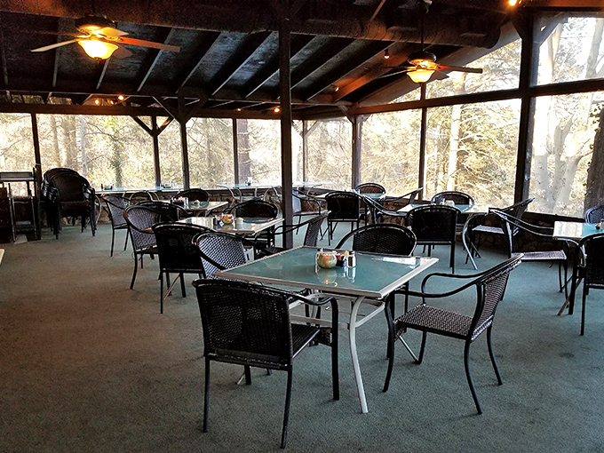 Empty tables that won't stay that way for long. The calm before the carnivorous storm in The Peddler's airy porch dining area.
