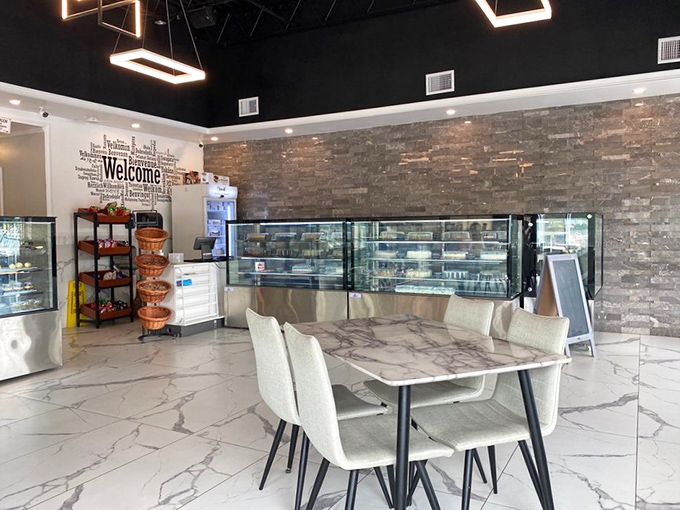 Clean lines and marble tables create a gallery-like setting where the real art is what arrives on your plate.