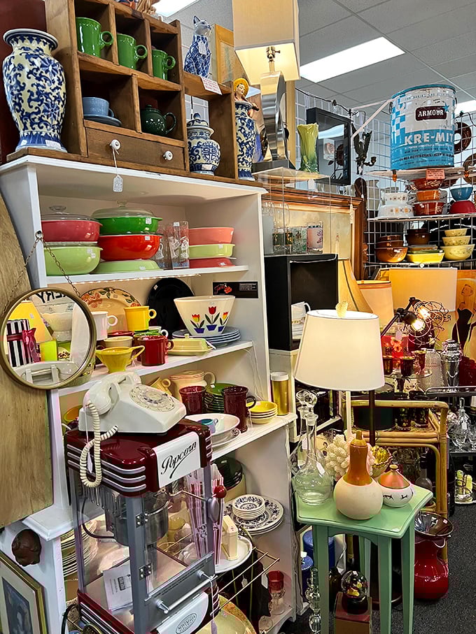 Mid-century kitchen dreams in technicolor! Those Pyrex bowls have probably served more family recipes than a church cookbook collection.