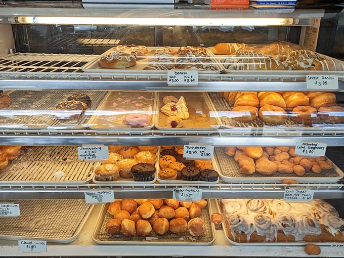 Pastry paradise, meticulously arranged. Like the Sistine Chapel of baked goods, each shelf offers its own divine inspiration.